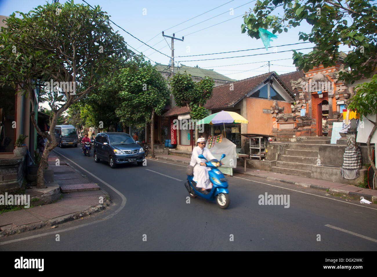 street scene Ubud Bali Indonesia traffic bikes car congestion movement ...