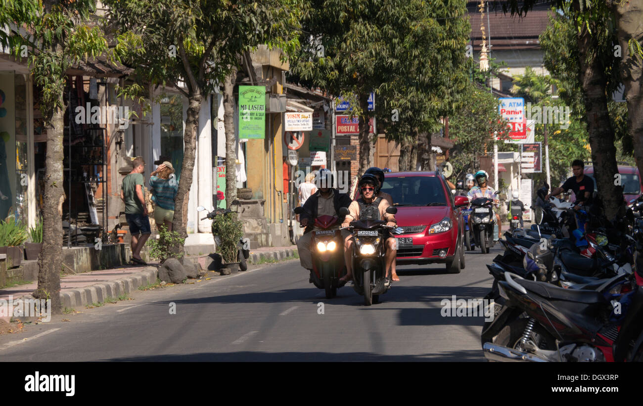 street scene Ubud Bali Indonesia traffic bikes car congestion movement ...