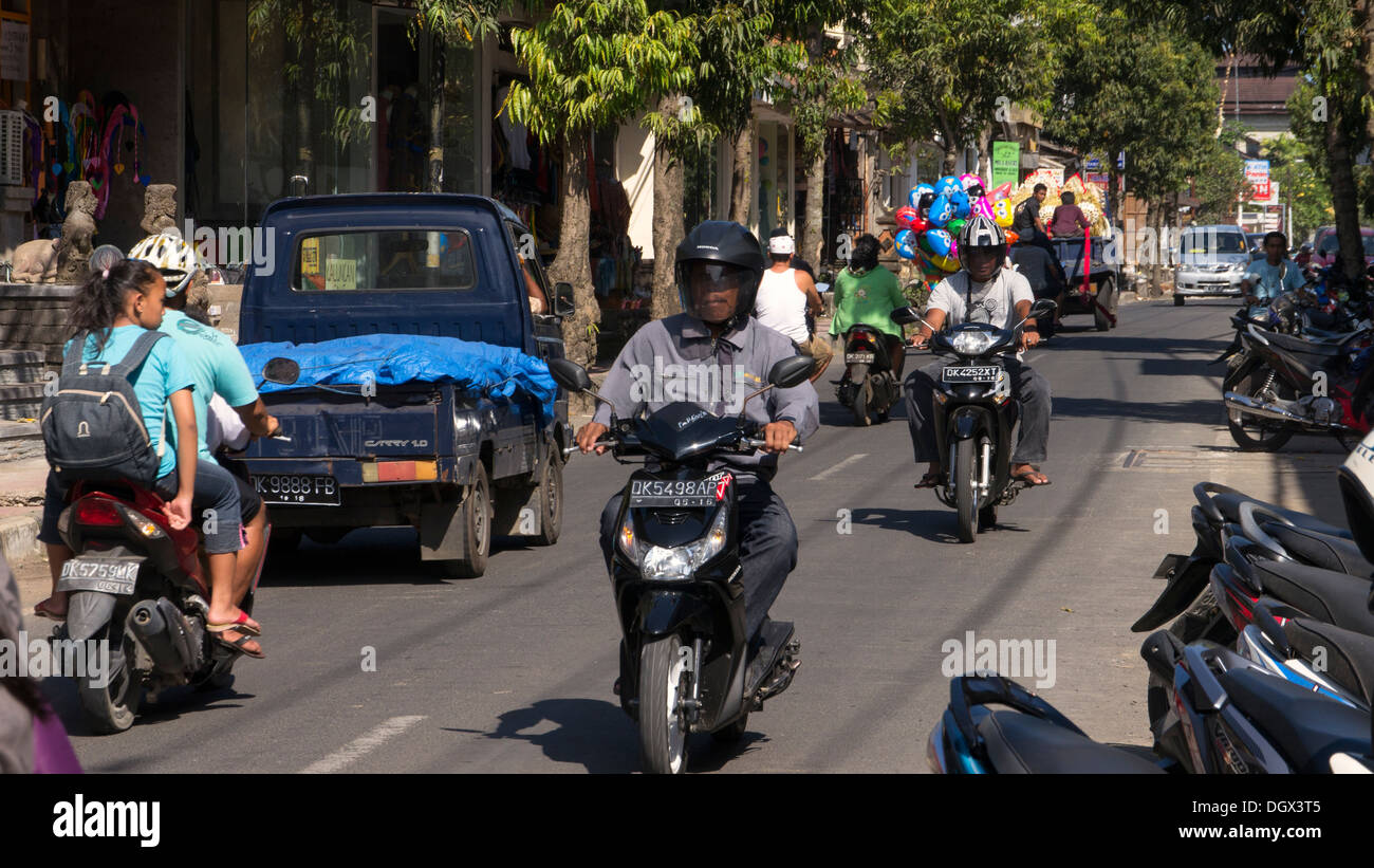 street scene Ubud Bali Indonesia traffic bikes car congestion movement ...