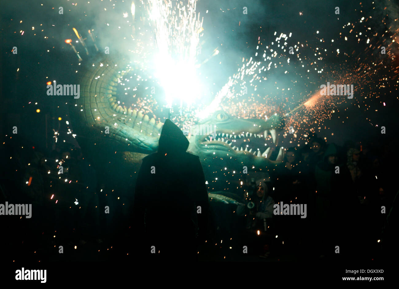 People dance surrounded by fire and pyrotechnics during a traditional ...