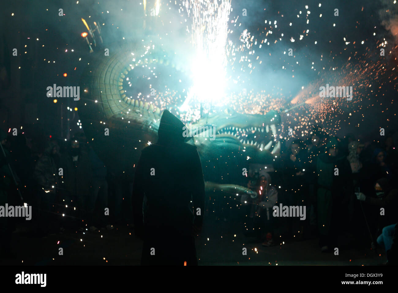 People dance surrounded by fire and pyrotechnics during a traditional ...