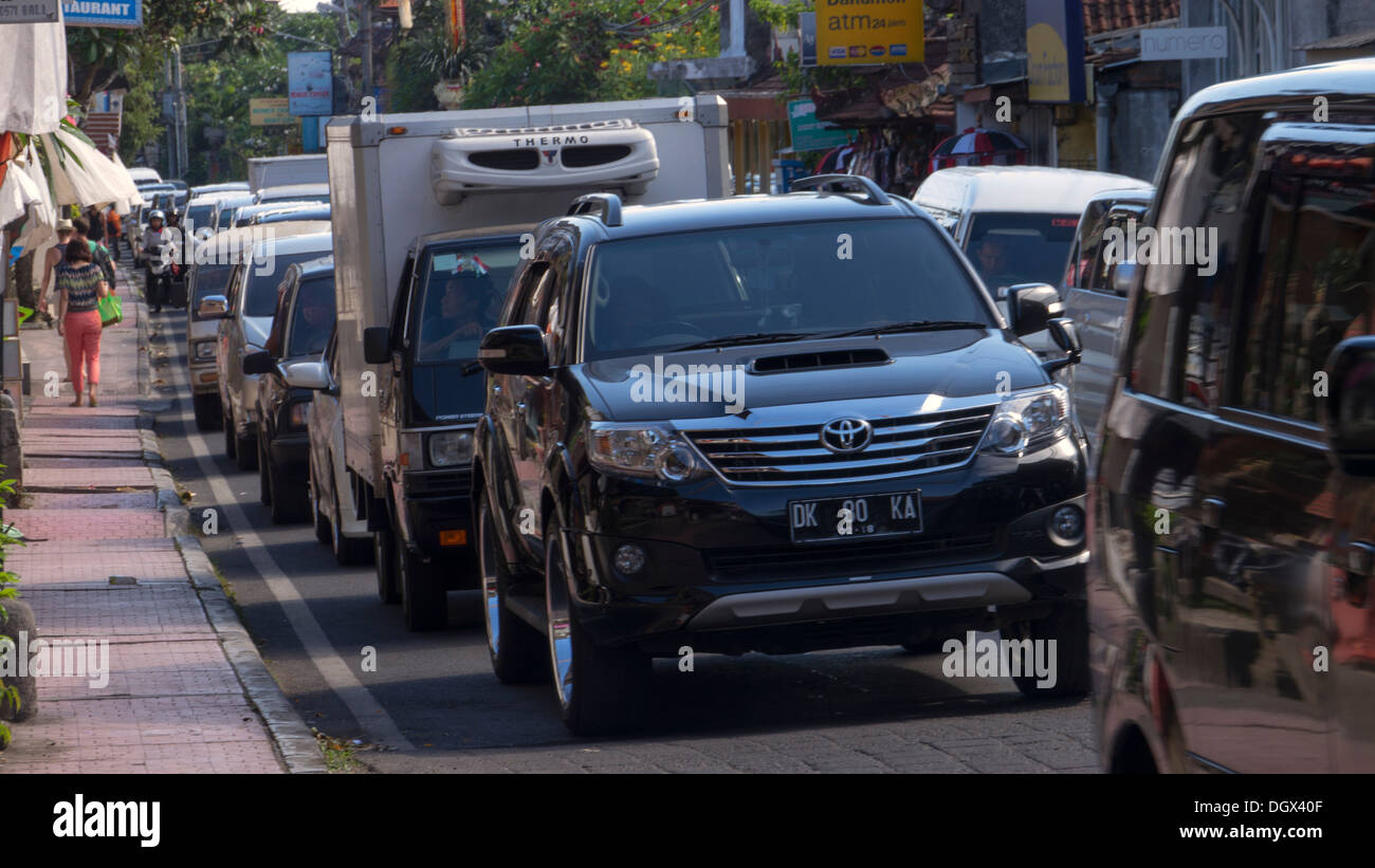 Traffic jam Ubud Indonesia Bali city main street cars congestion people ...