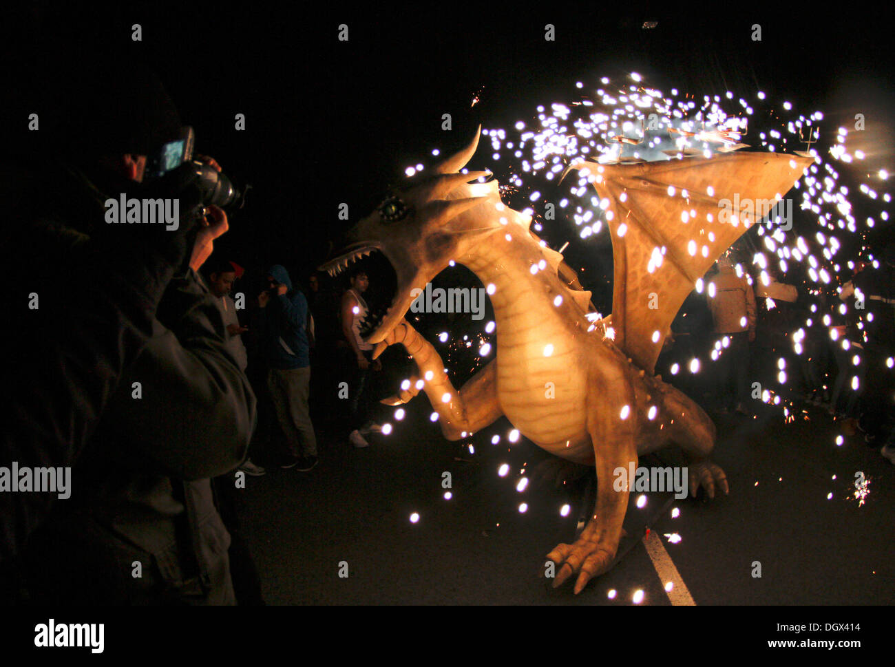 People dance surrounded by fire and pyrotechnics during a traditional ...