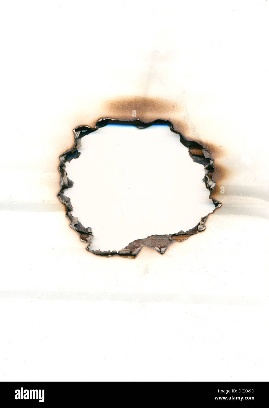 burn hole in paper Stock Photo - Alamy