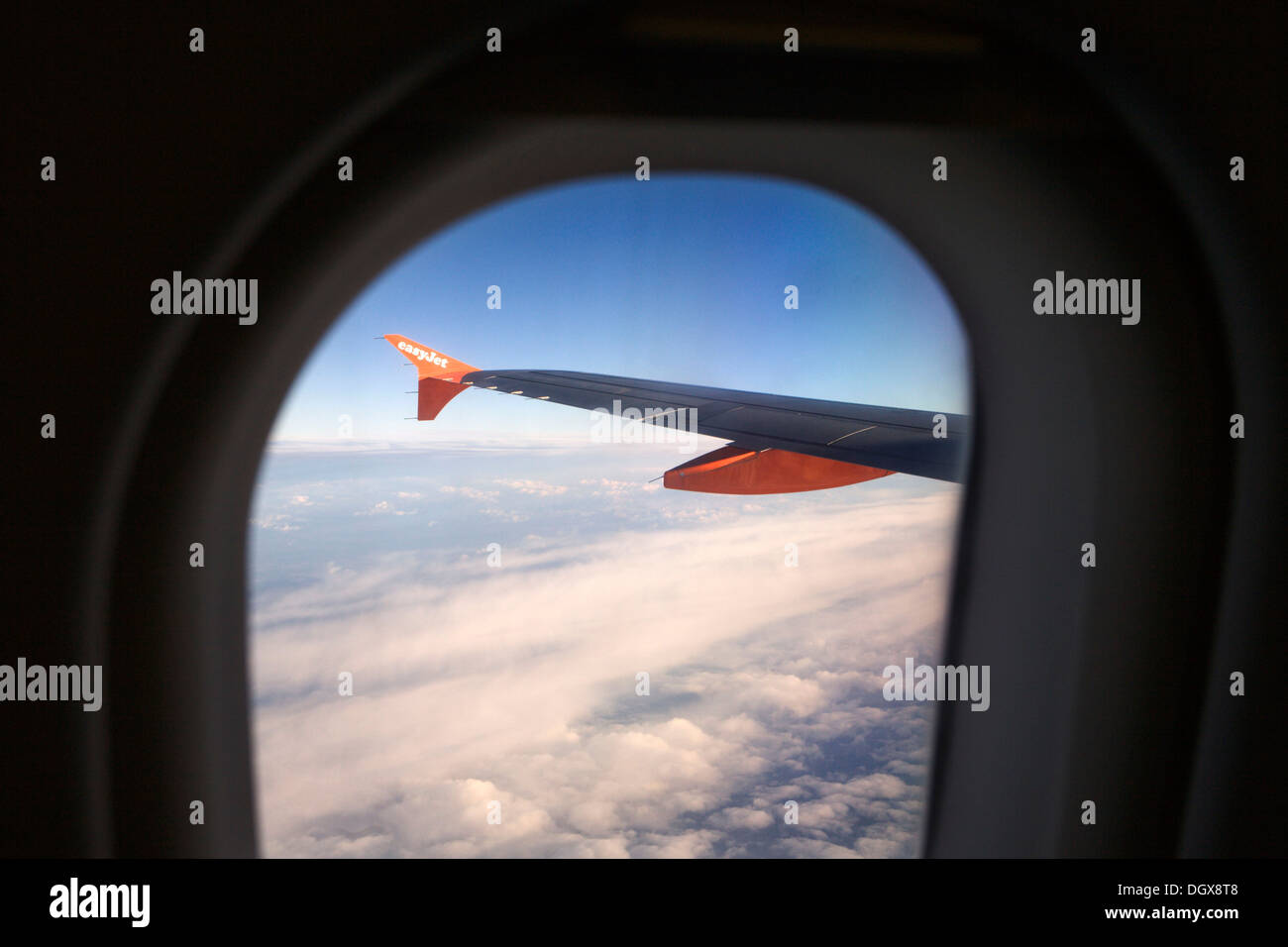 View through the cabin window to the left wing of an Airbus A319-100 of ...