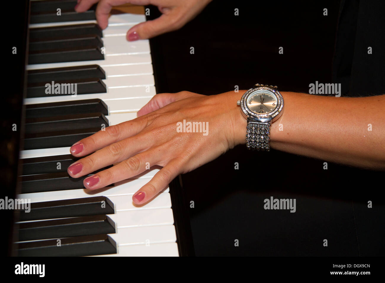 Female Hands Playing Piano with Bling Diamond Watch Stock Photo - Alamy
