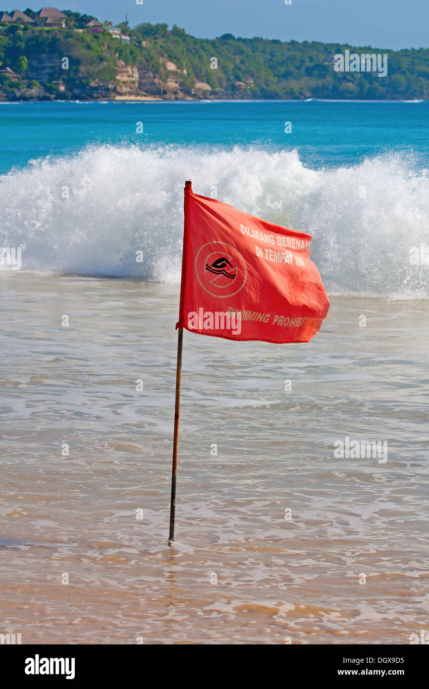 Red warning flag on the beach Stock Photo - Alamy