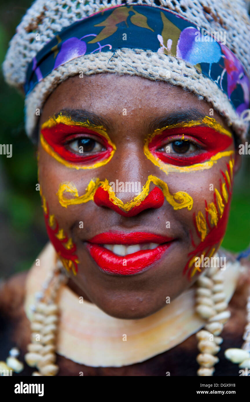 Girl with colourful decorations and face paint is celebrating at the ...