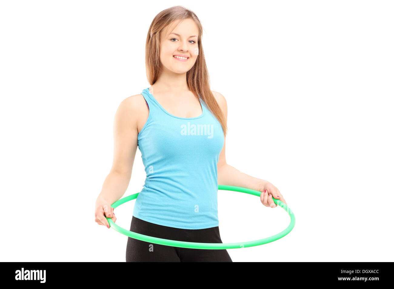 Young female athlete exercising with a hula-hoop Stock Photo - Alamy