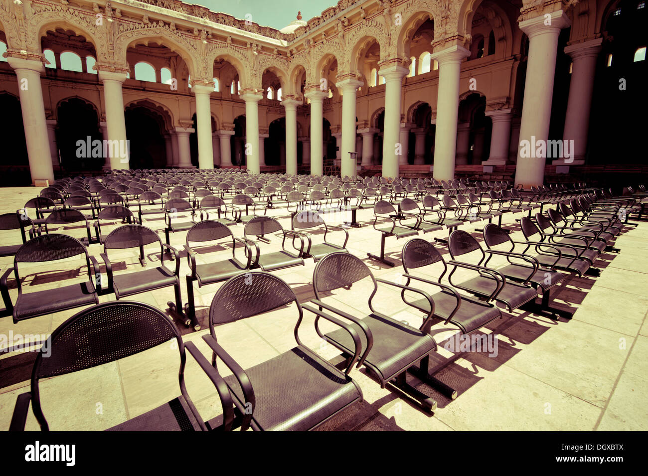 Rows chairs at outdoors concert hall ancient columns under cloudy sky ...