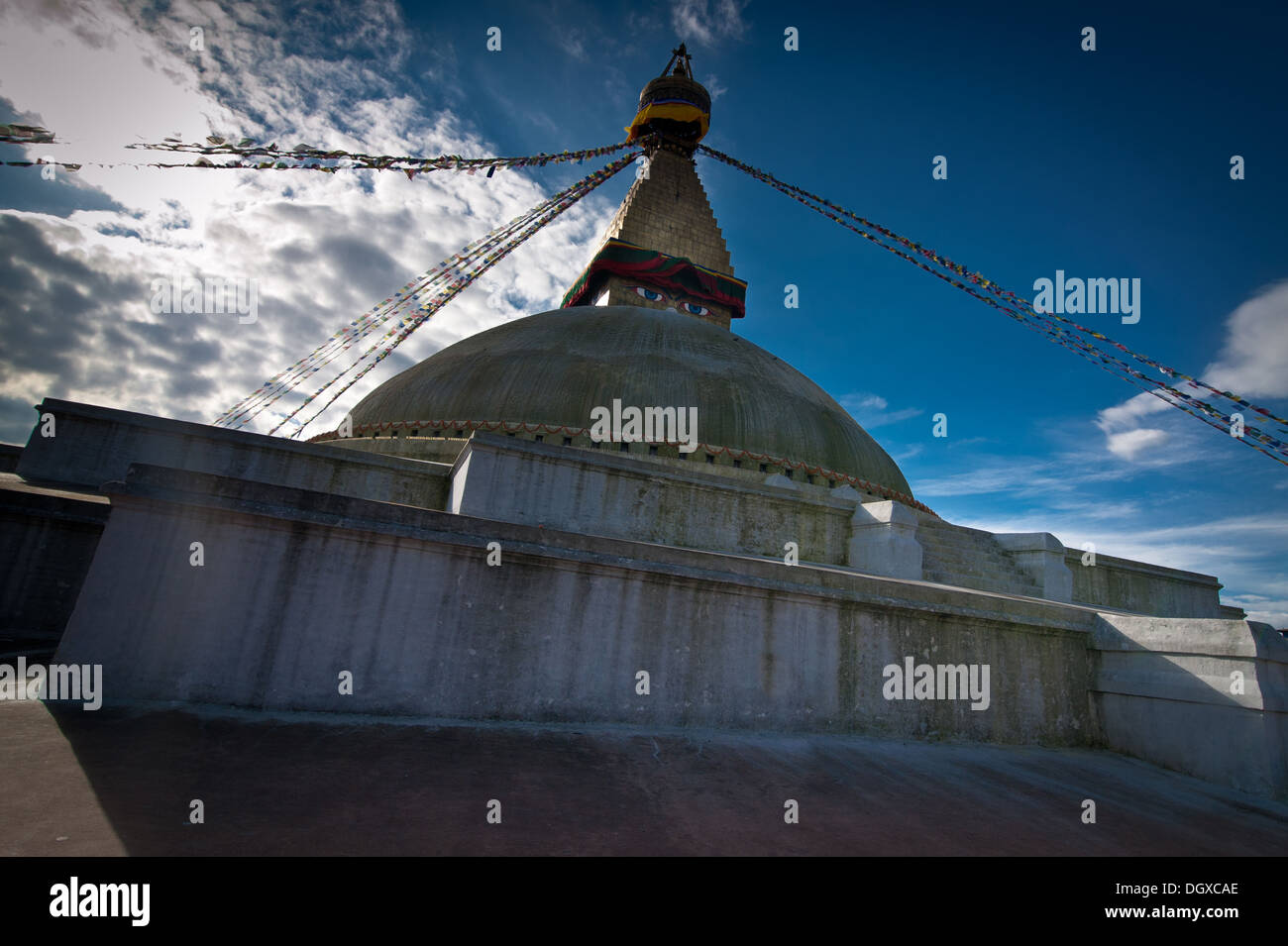 Buddhist Shrine Boudhanath Stupa with pray flags over sunset sky. Nepal ...