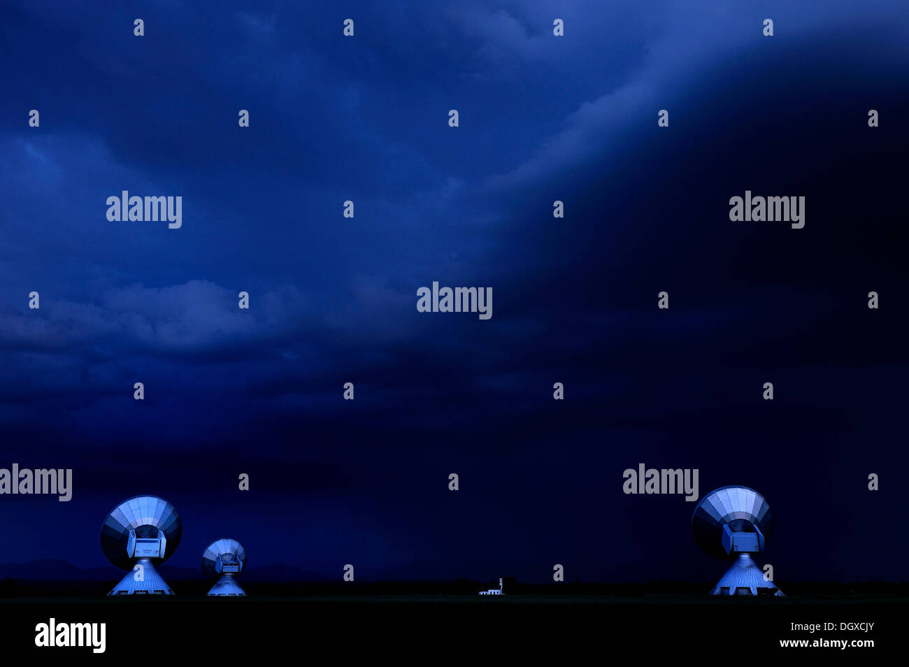 Raisting satellite earth station in front of a church at night ...