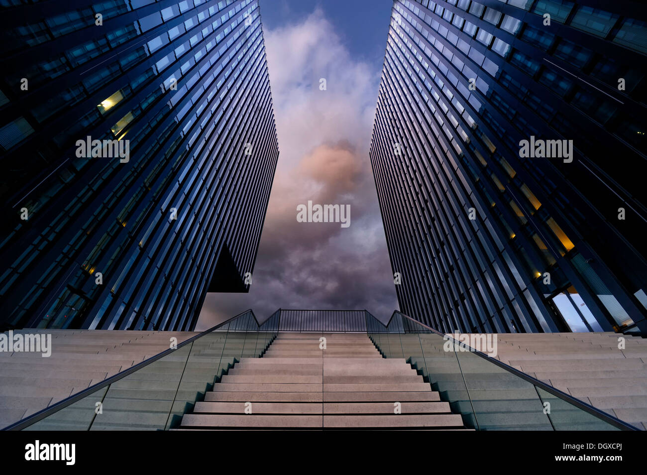 Stone staircase with the Hyatt Regency Hotel at dusk, Medienhafen ...