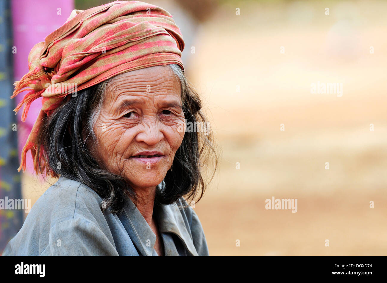 Old woman wearing scarf hi-res stock photography and images - Alamy