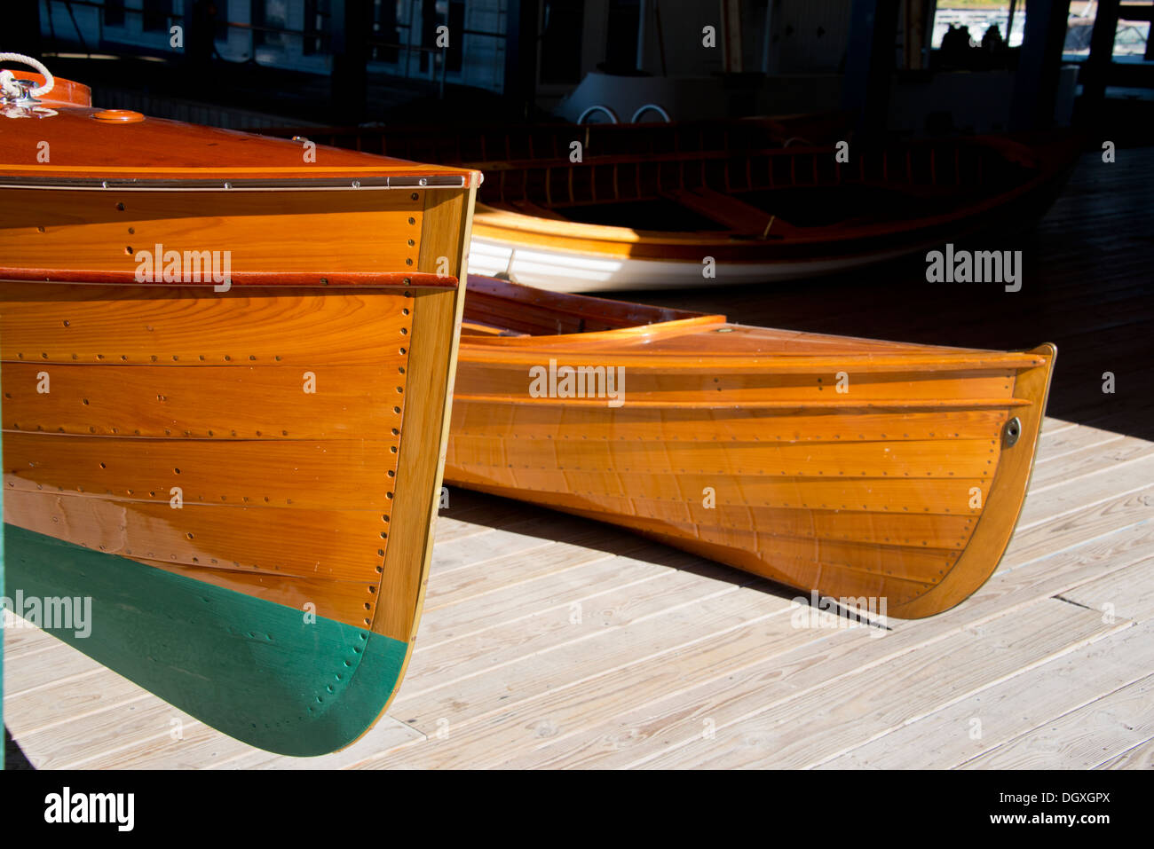 New York, Clayton. Antique Boat Museum. Bow of wooden canoe with Southerland Boat and Coach ...