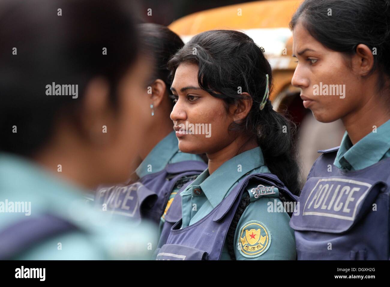 Oct, 2013. Bangladeshi woman police personel stand guard in front of a ...