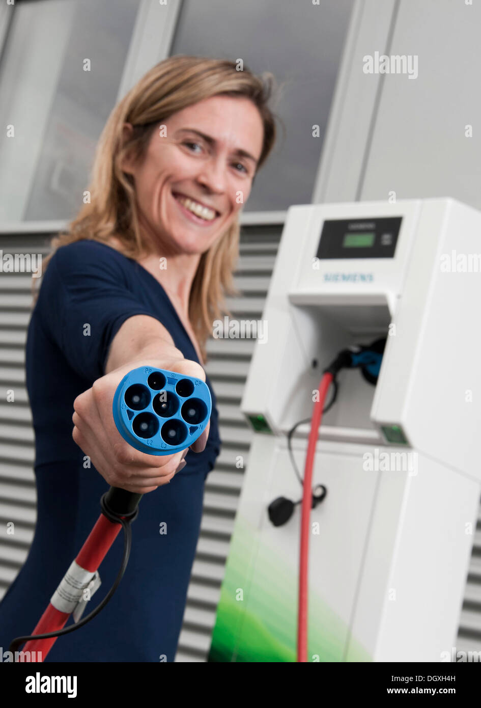 Woman poses smiles during hi-res stock photography and images - Alamy