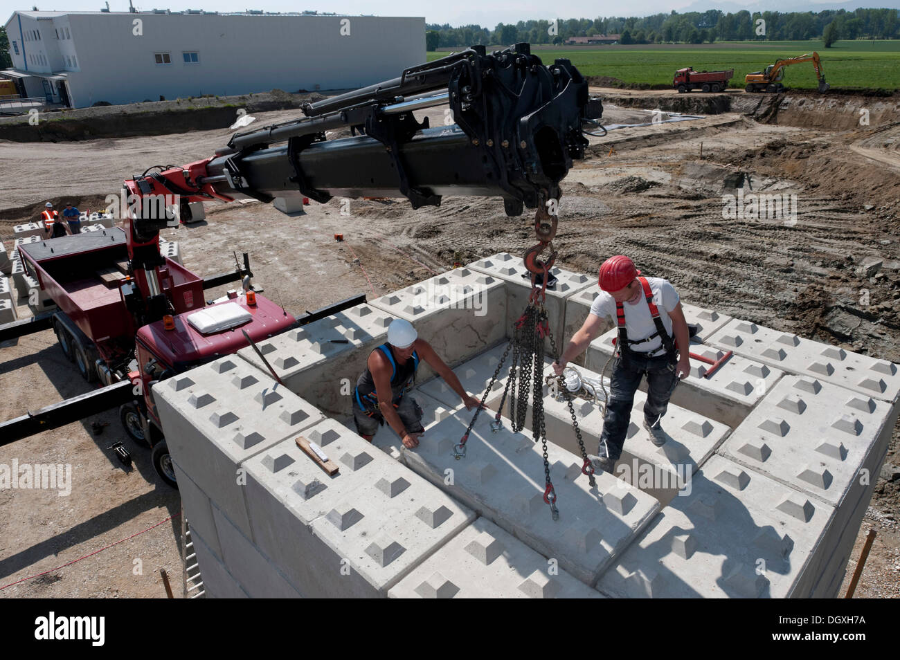 Construction workers stacking blocks during a building site load test ...