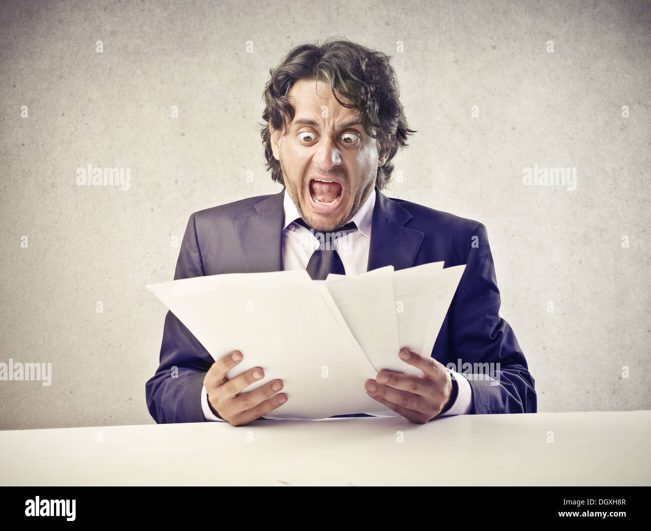 Businessman screaming reading papers hi-res stock photography and ...
