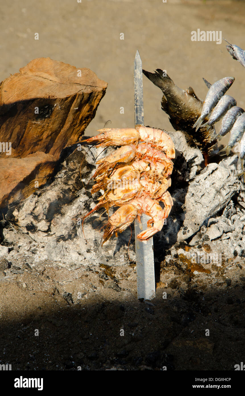 Grilled prawns, fish and sardines on the barbeque grill. Southern Spain ...