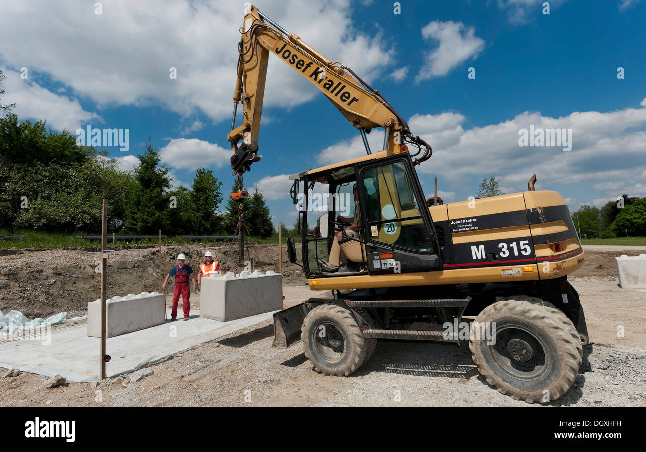 Structural engineers placing the first blocks during a building site ...