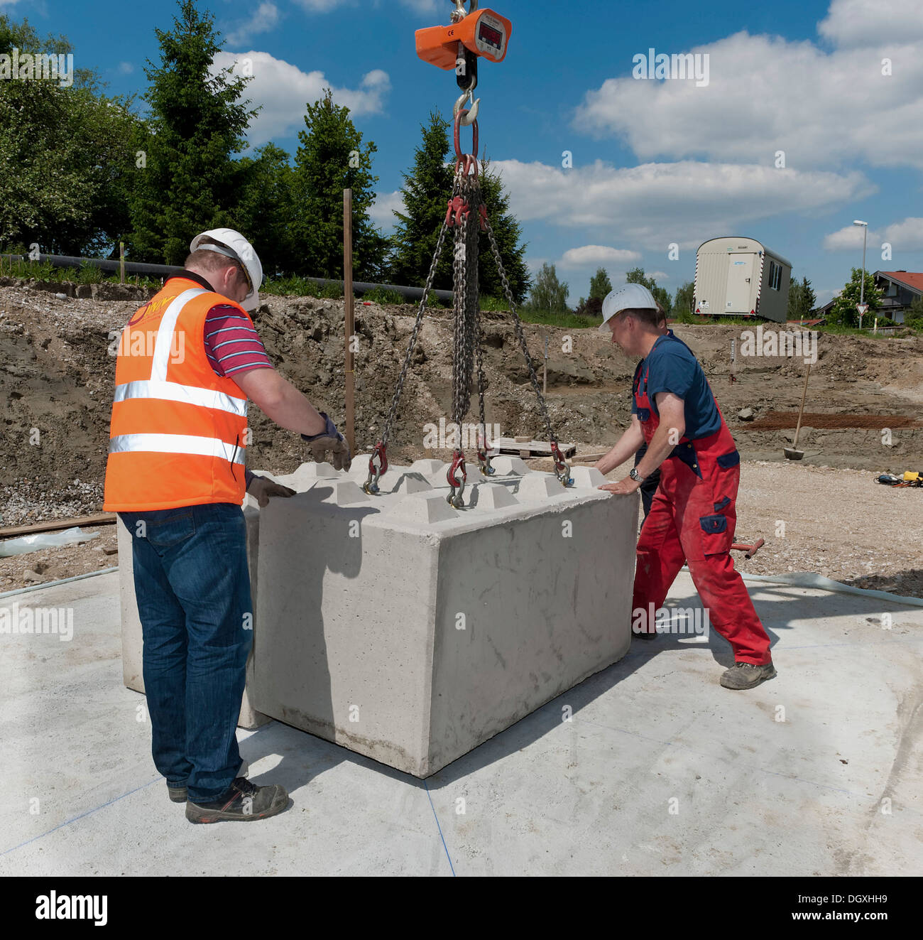 Structural engineers placing the first blocks during a building site ...