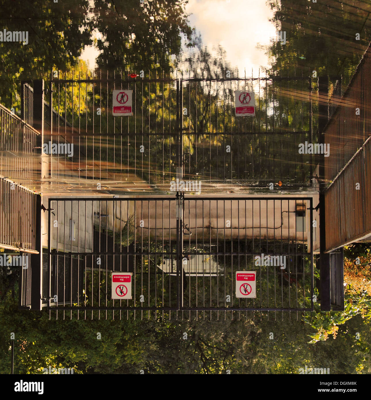 upside down reflection of a gate in a large puddle Stock Photo - Alamy