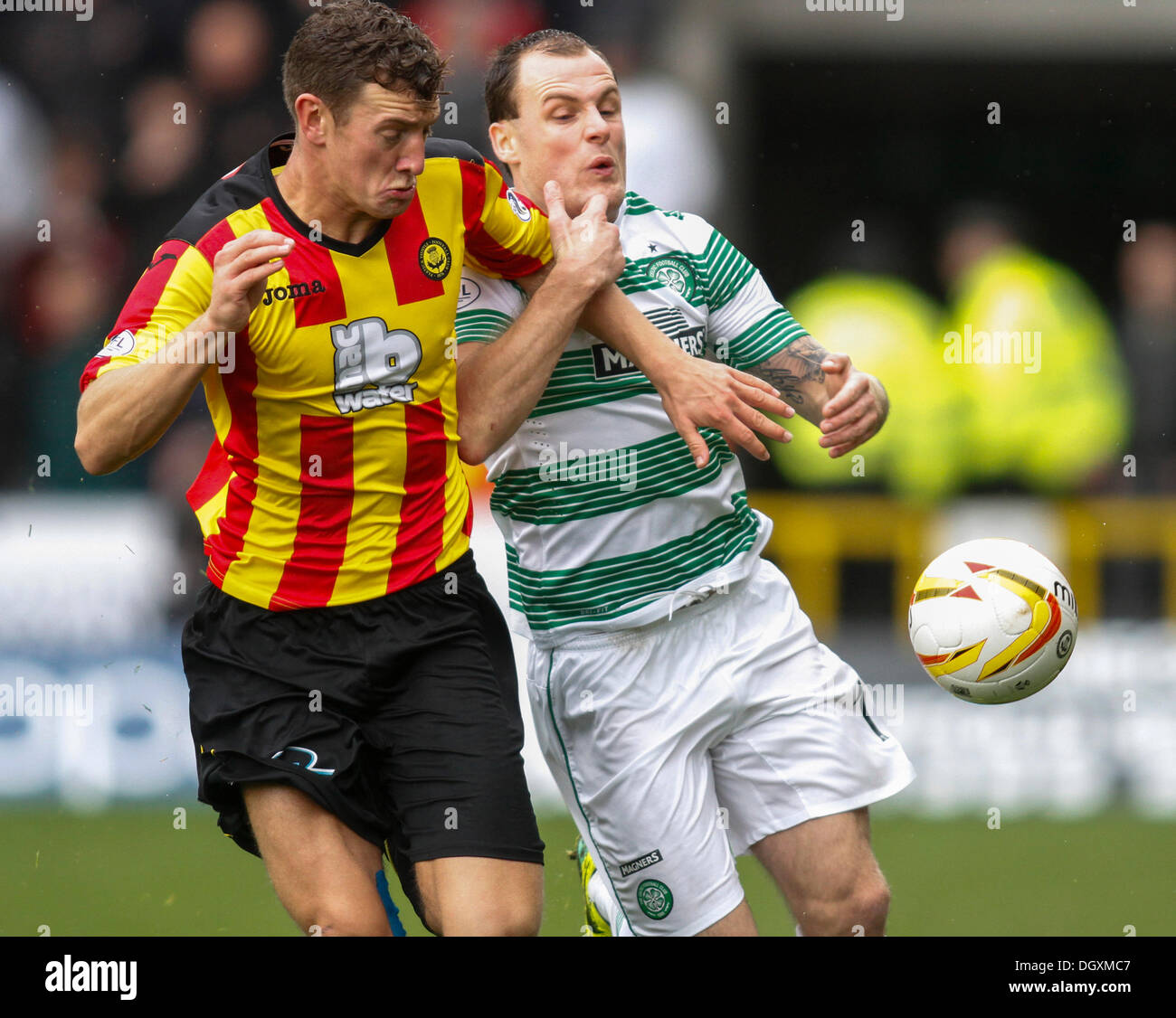 Glasgow, Scotland. 27th Oct, 2013. Anthony Stokes is held off by Aaron ...