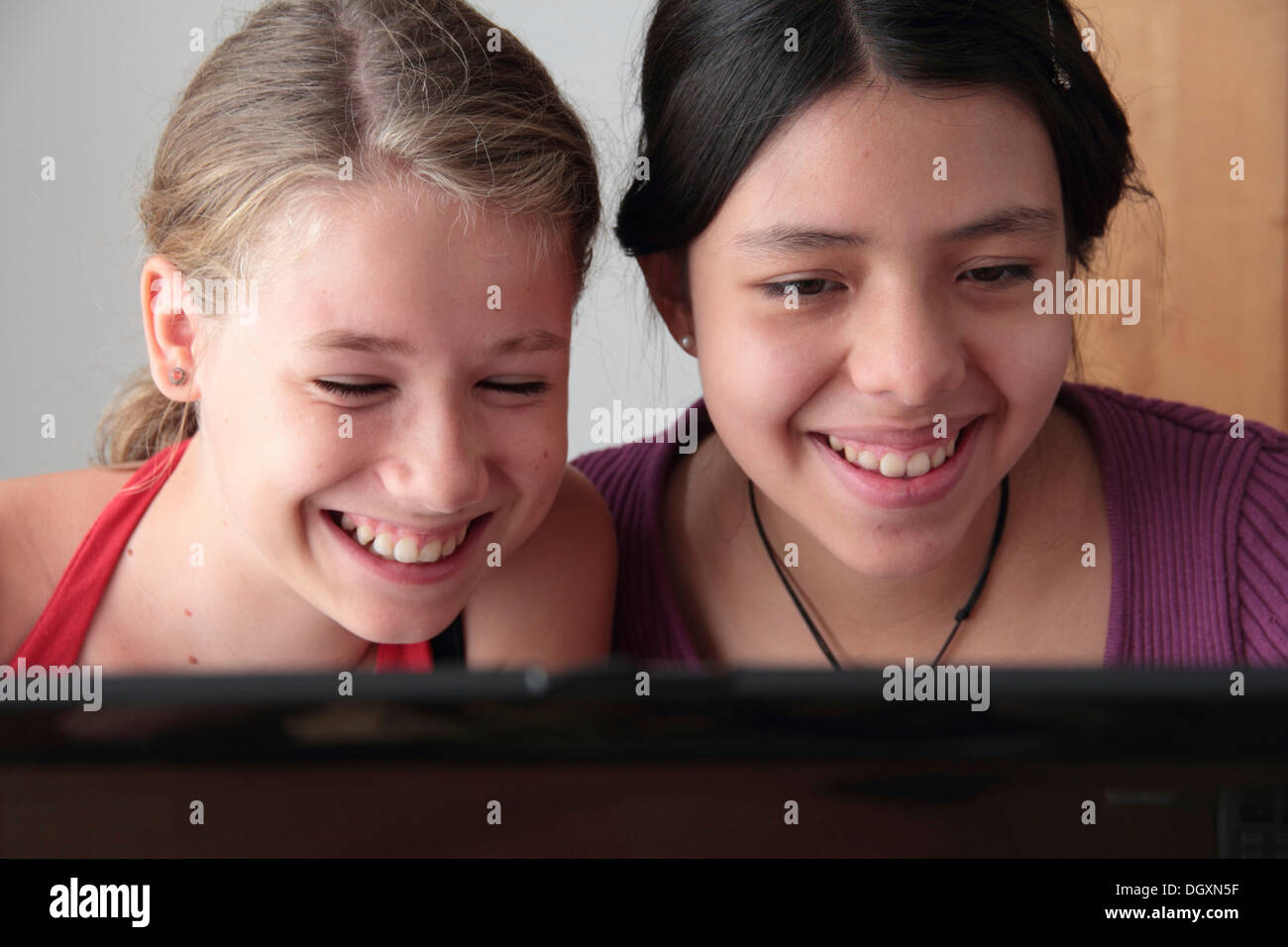 Teenagers on a laptop computer Stock Photo - Alamy