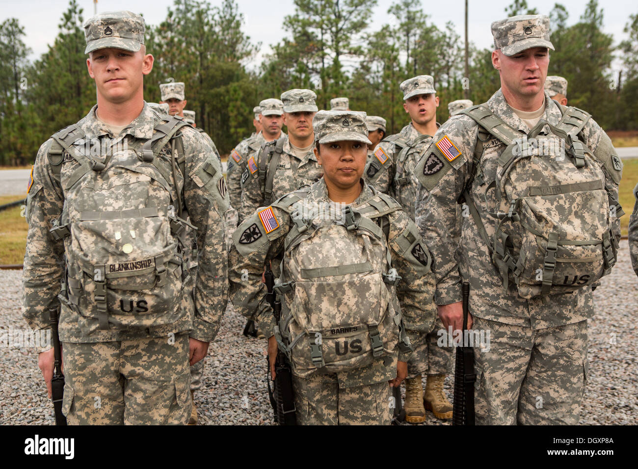 A women Drill Sergeant candidate stands with her male counterparts at ...