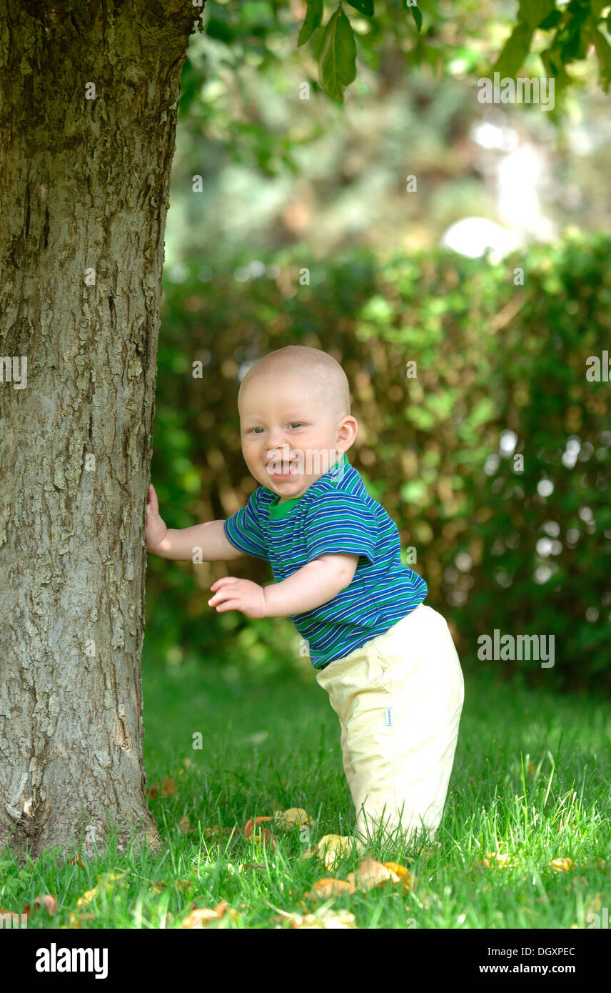 Lean against tree standing hi-res stock photography and images - Alamy