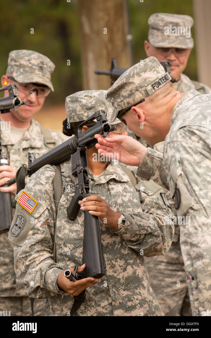 A woman Drill Sergeant candidate has her weapon inspected at the US ...
