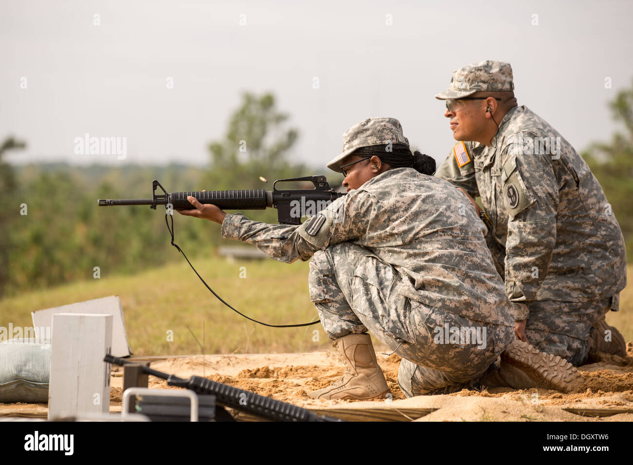 A woman Drill Sergeant candidate prepares to fire her rifle at the US ...