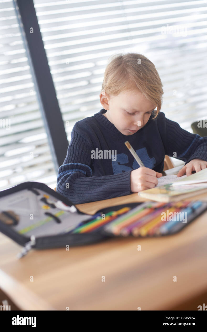 Schoolboy, 7 years, doing his homework, Germany Stock Photo - Alamy