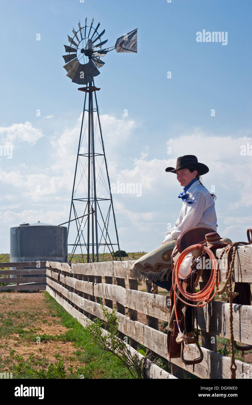Cowgirl sitting on fence hi-res stock photography and images - Alamy