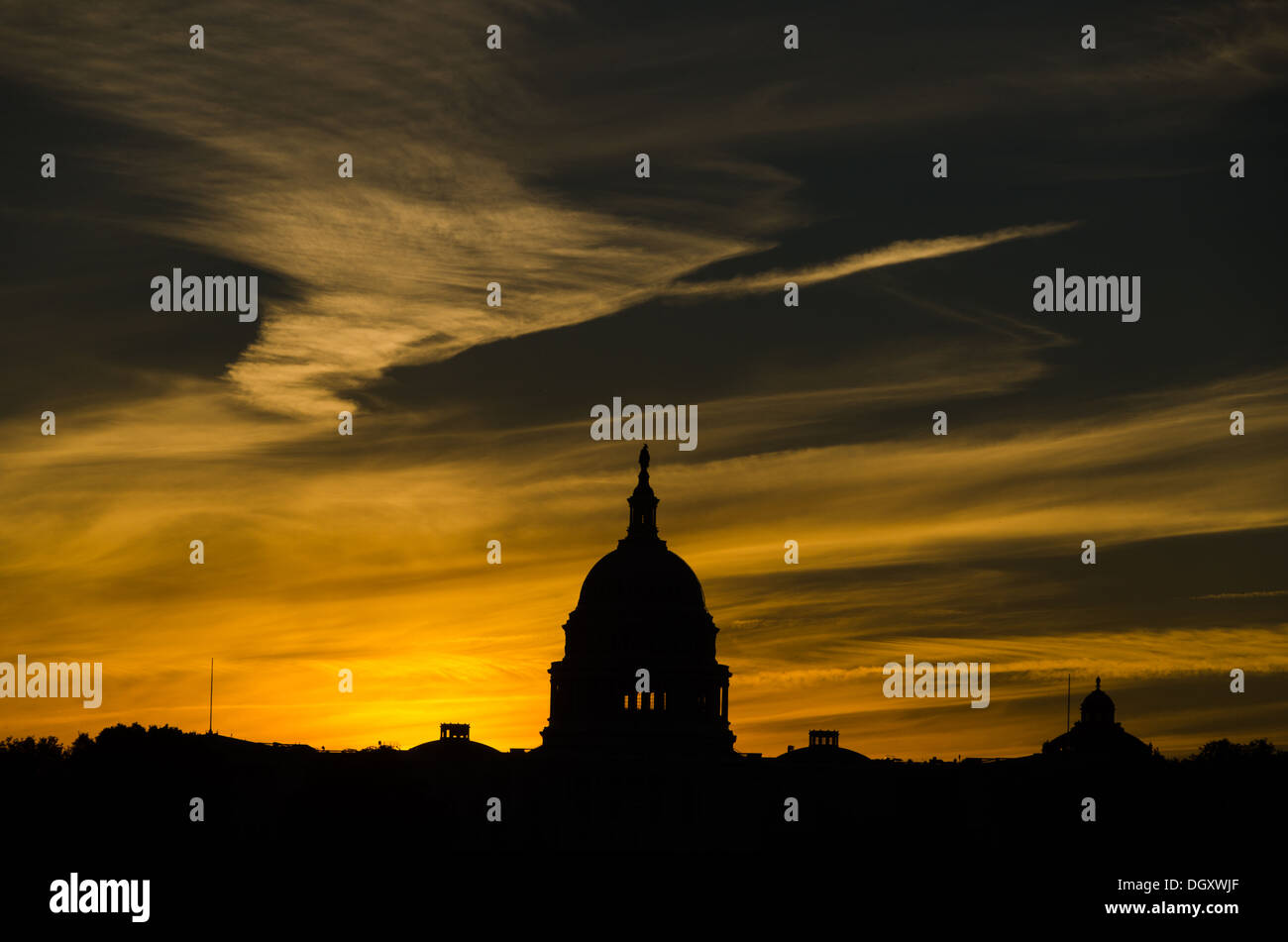 WASHINGTON DC, United States — The sun rises behind a silhouette of the ...