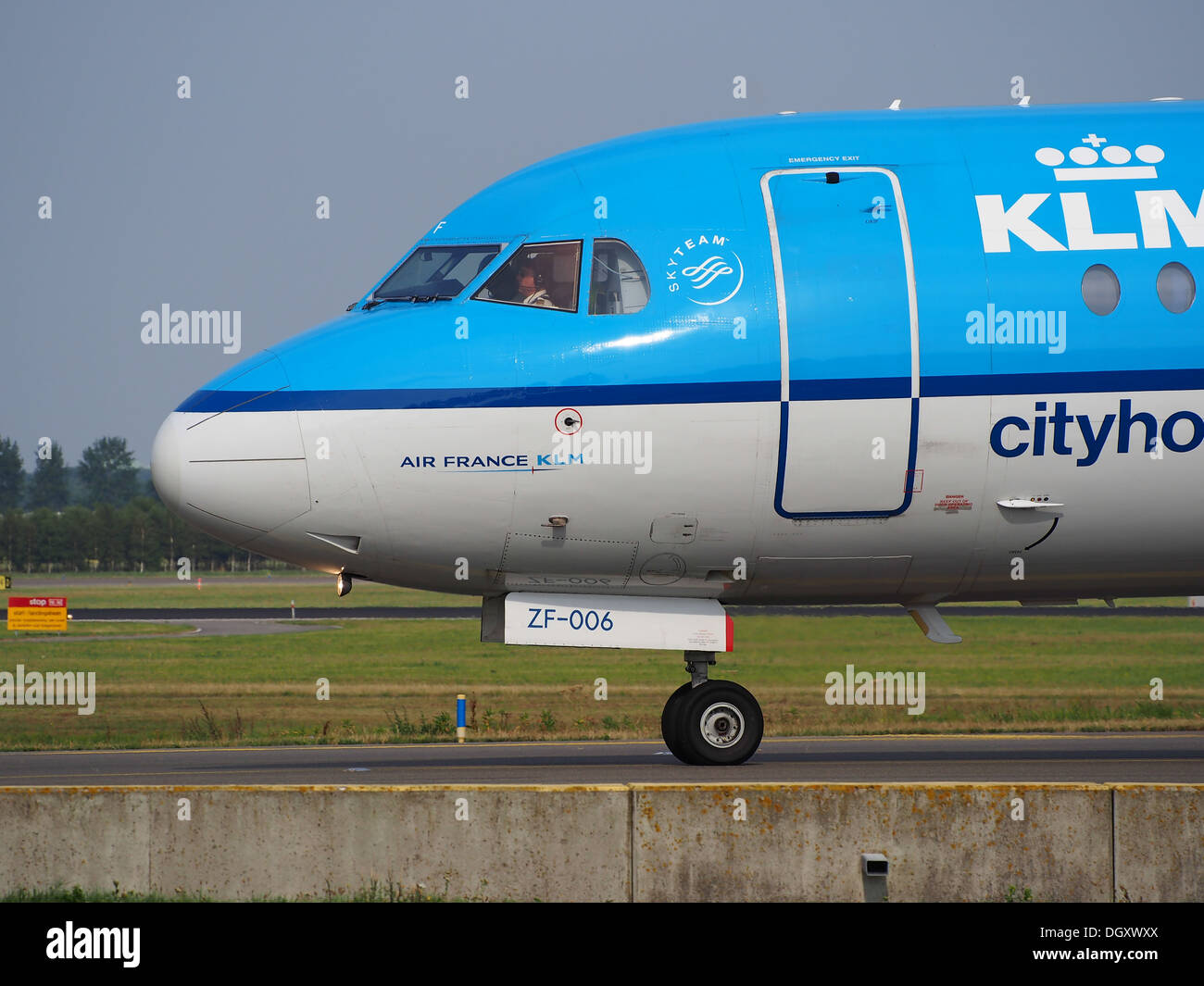 PH-KZF is a KLM Cityhopper Fokker F70 aircraft taxiing at Schiphol ...