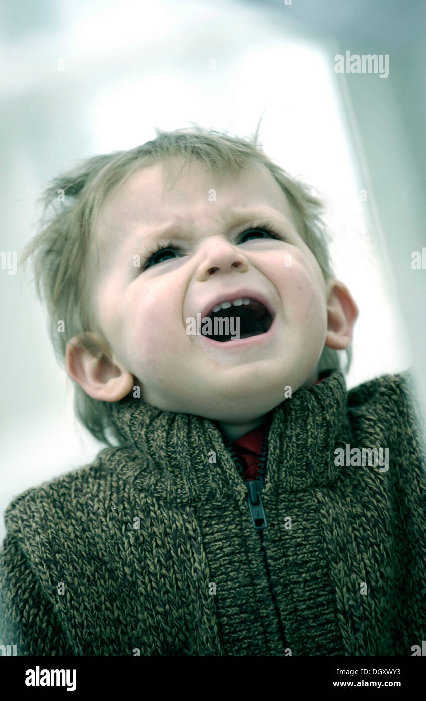 Young boy shouting Stock Photo - Alamy