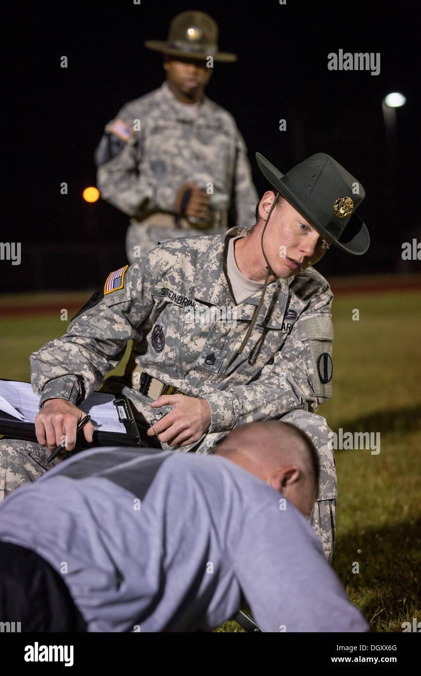 A female Drill Sergeant instructor monitors a Drill Sergeant candidate ...