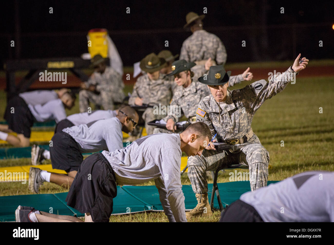 A female Drill Sergeant instructor monitors a Drill Sergeant candidate ...