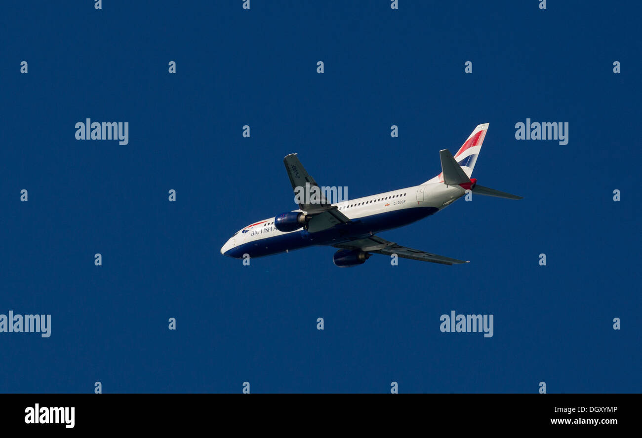 British Airways airliner flying in clear blue sky Stock Photo - Alamy