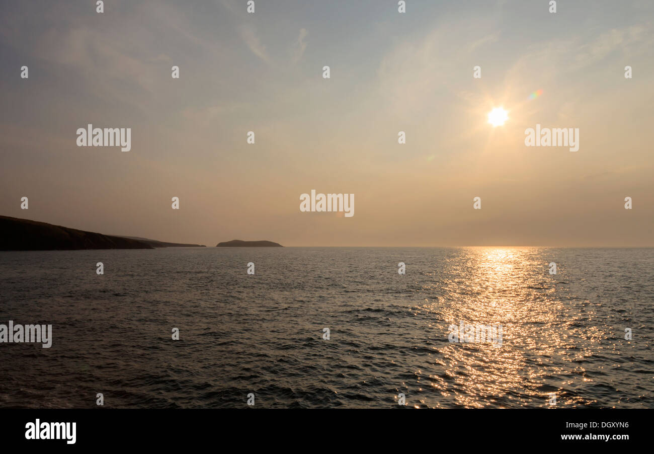 The Sun sets over Mwnt Stock Photo - Alamy