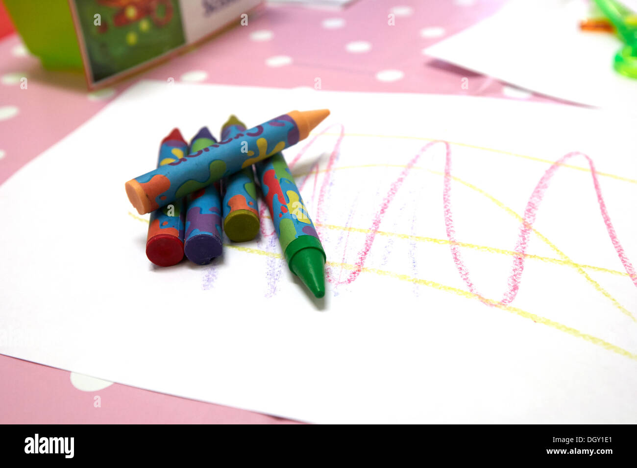 childrens crayons and drawings on a table Stock Photo - Alamy