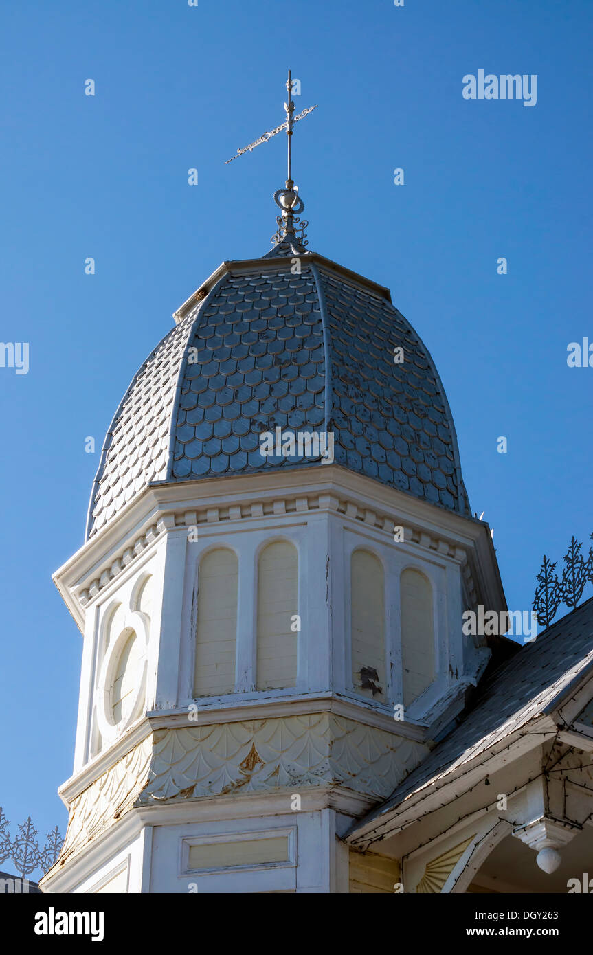 Domed octagonal tower or turret on Victorian house with metal roofing ...
