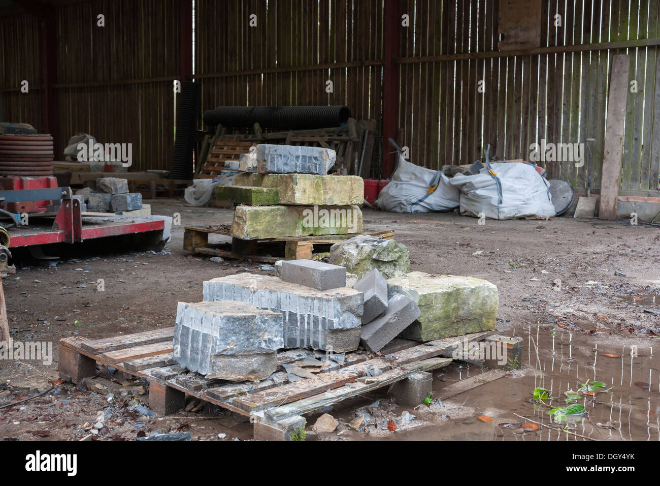 dressed building stone on pallet in storage shed Stock Photo - Alamy