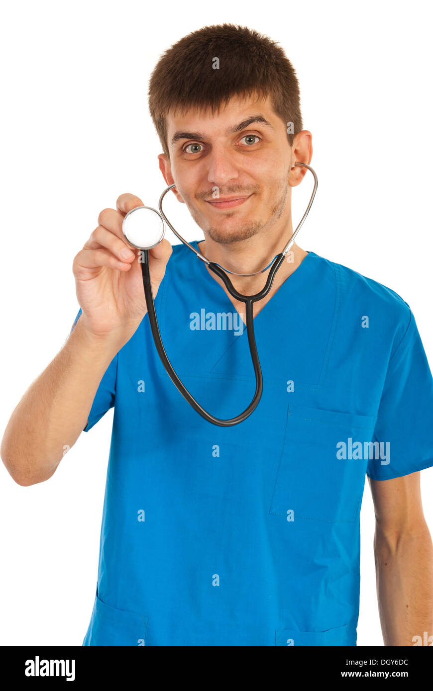 Happy young doctor showing stethoscope isolated on white background ...