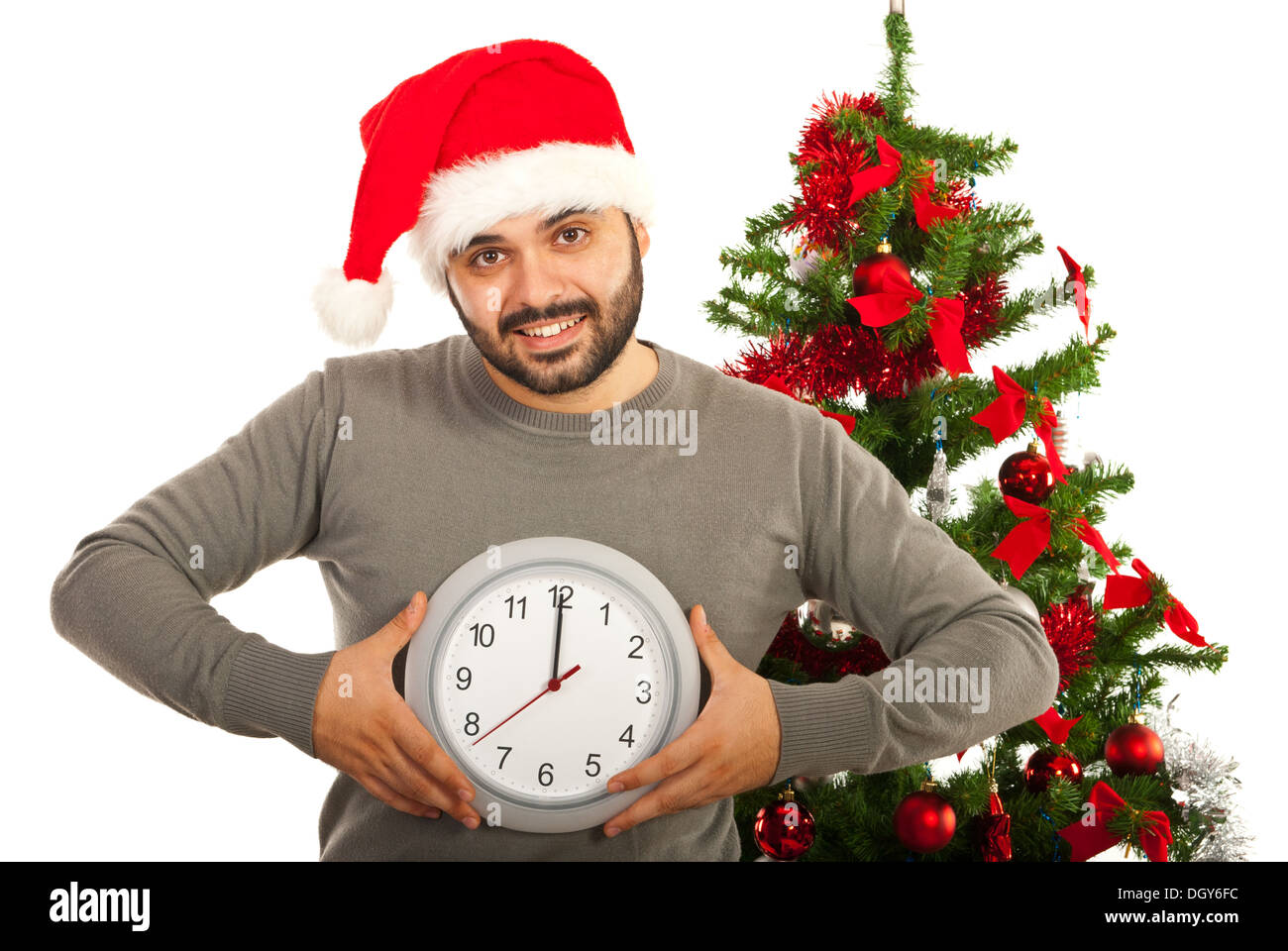 Happy Christmas man holding clock isolated on white background Stock ...