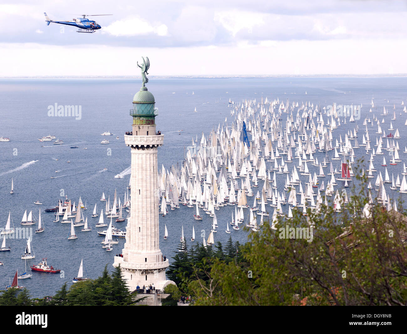 Faro della Vittoria lighthouse, sailing boats taking part in the ...