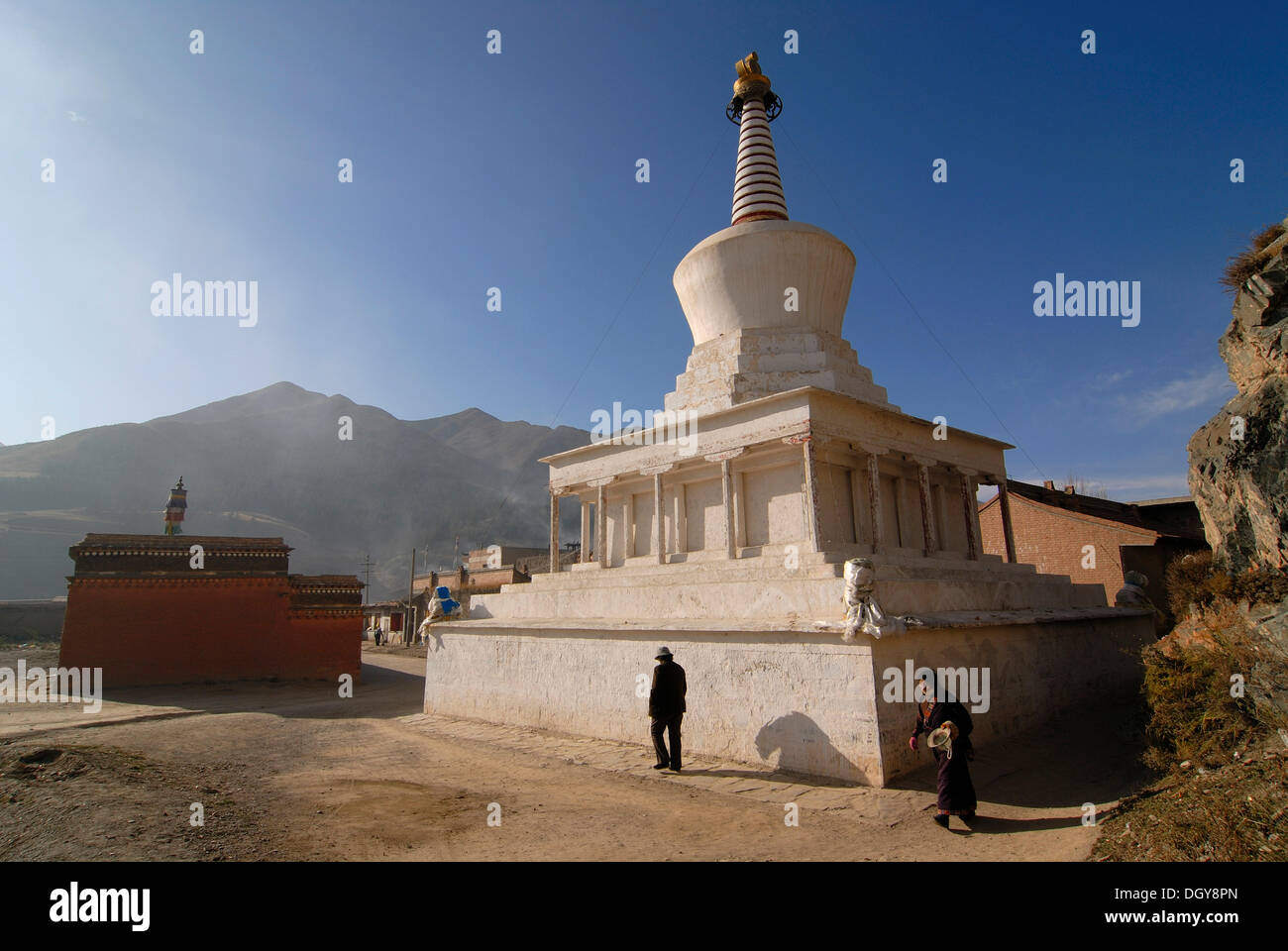 Two women circling a stupa of the Labrang monastery, Xiahe, Gansu ...