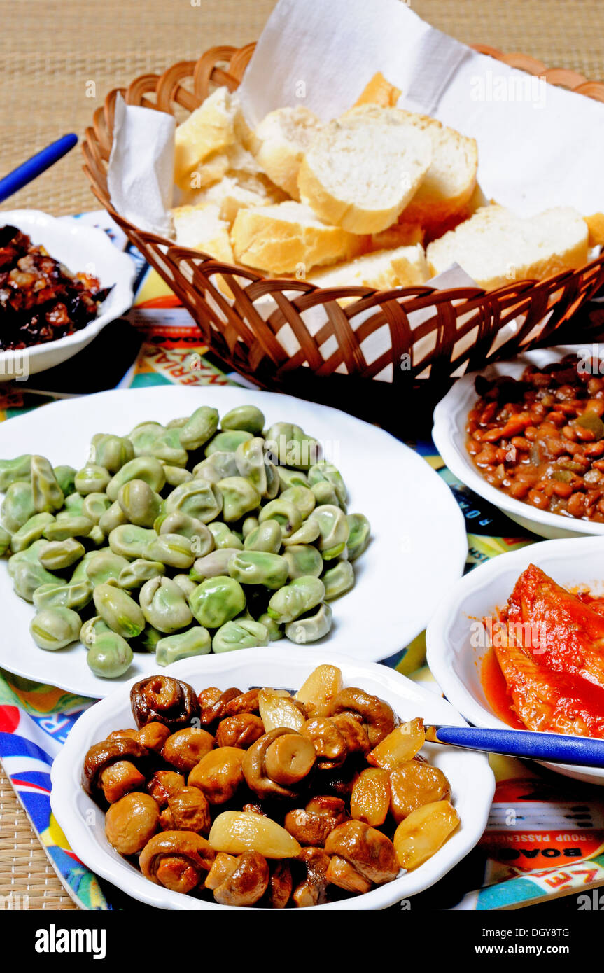 Spanish tapas selection of mushrooms, broad beans, lentils and fish ...